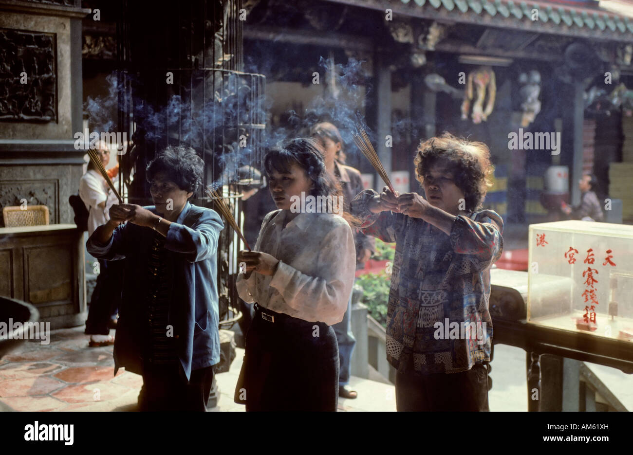 Women burning incense sticks Matsu Temple Lokang Taiwan Stock Photo - Alamy