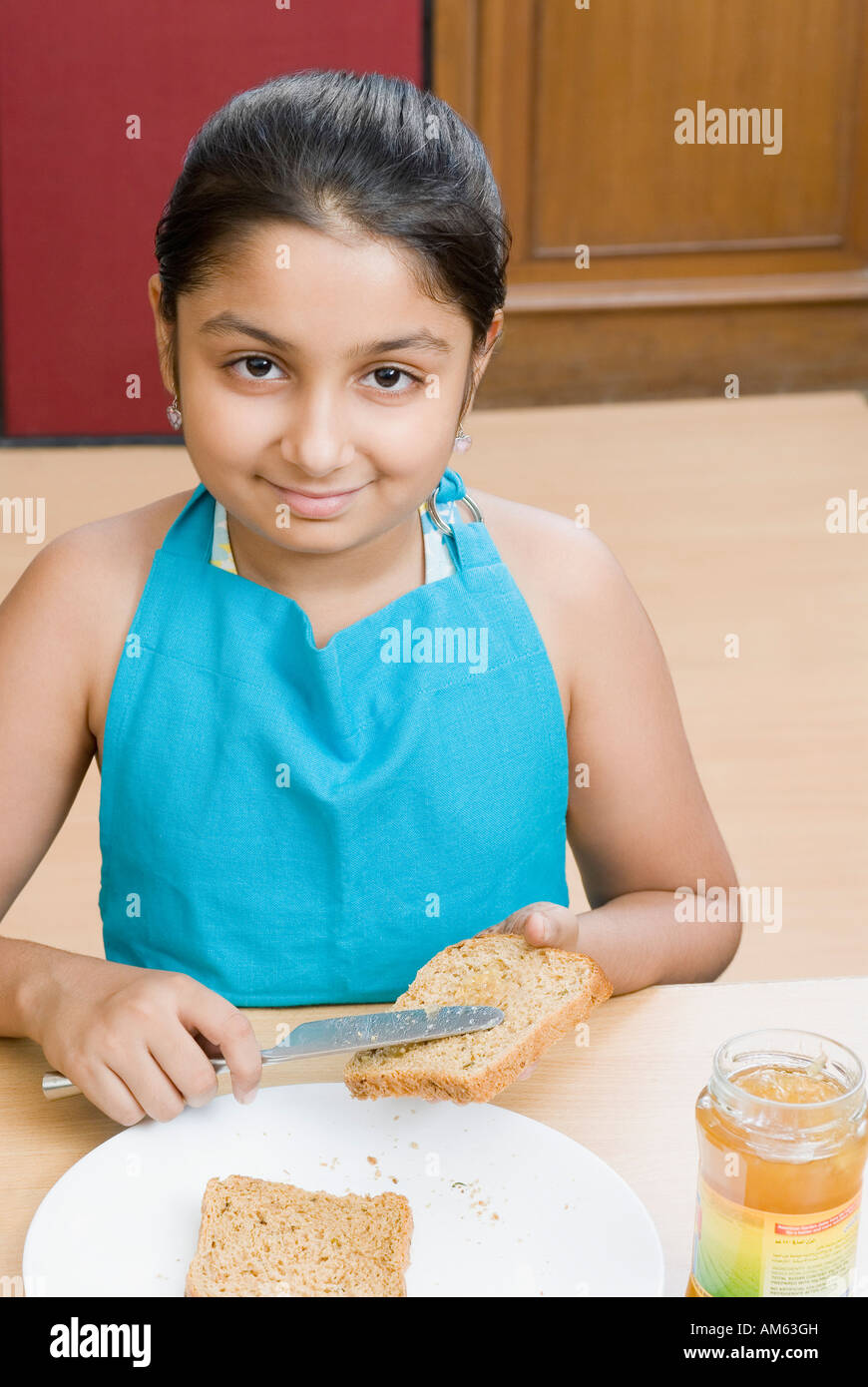 Indian kid eating bread hi-res stock photography and images - Alamy