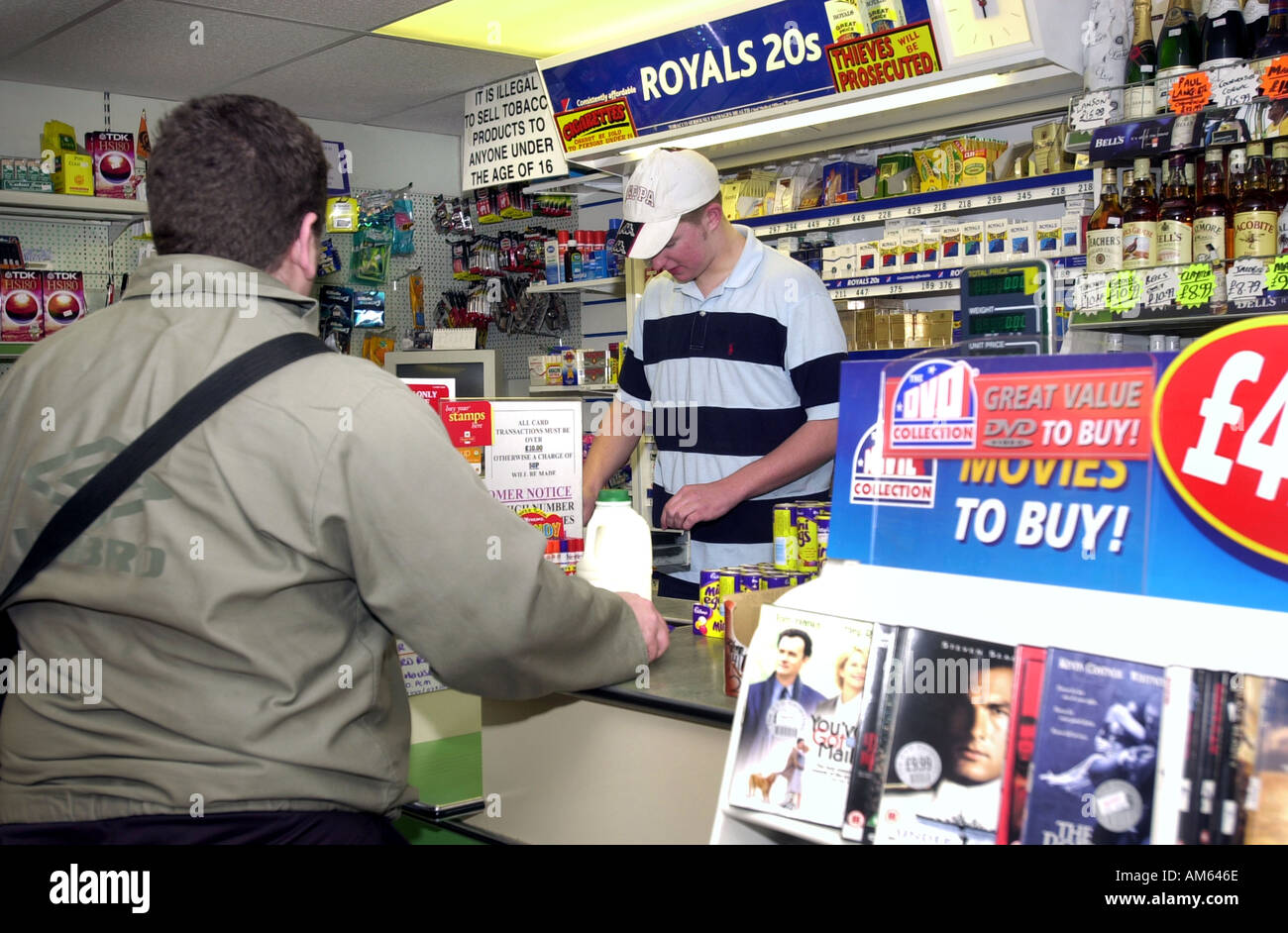 Shopkeeper serving a customer hi-res stock photography and images - Alamy