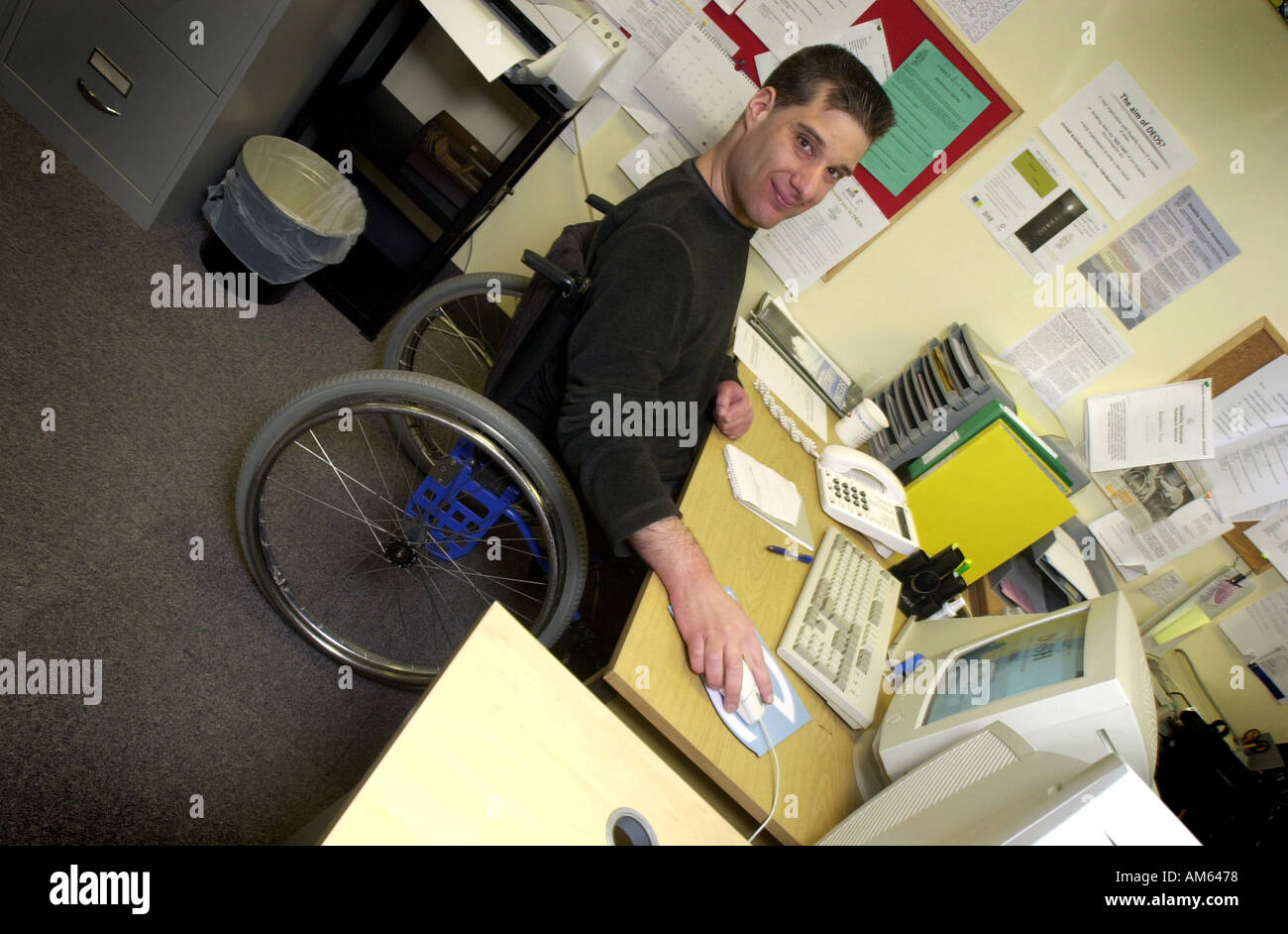 Disabled man at work in an office environment UK Stock Photo - Alamy