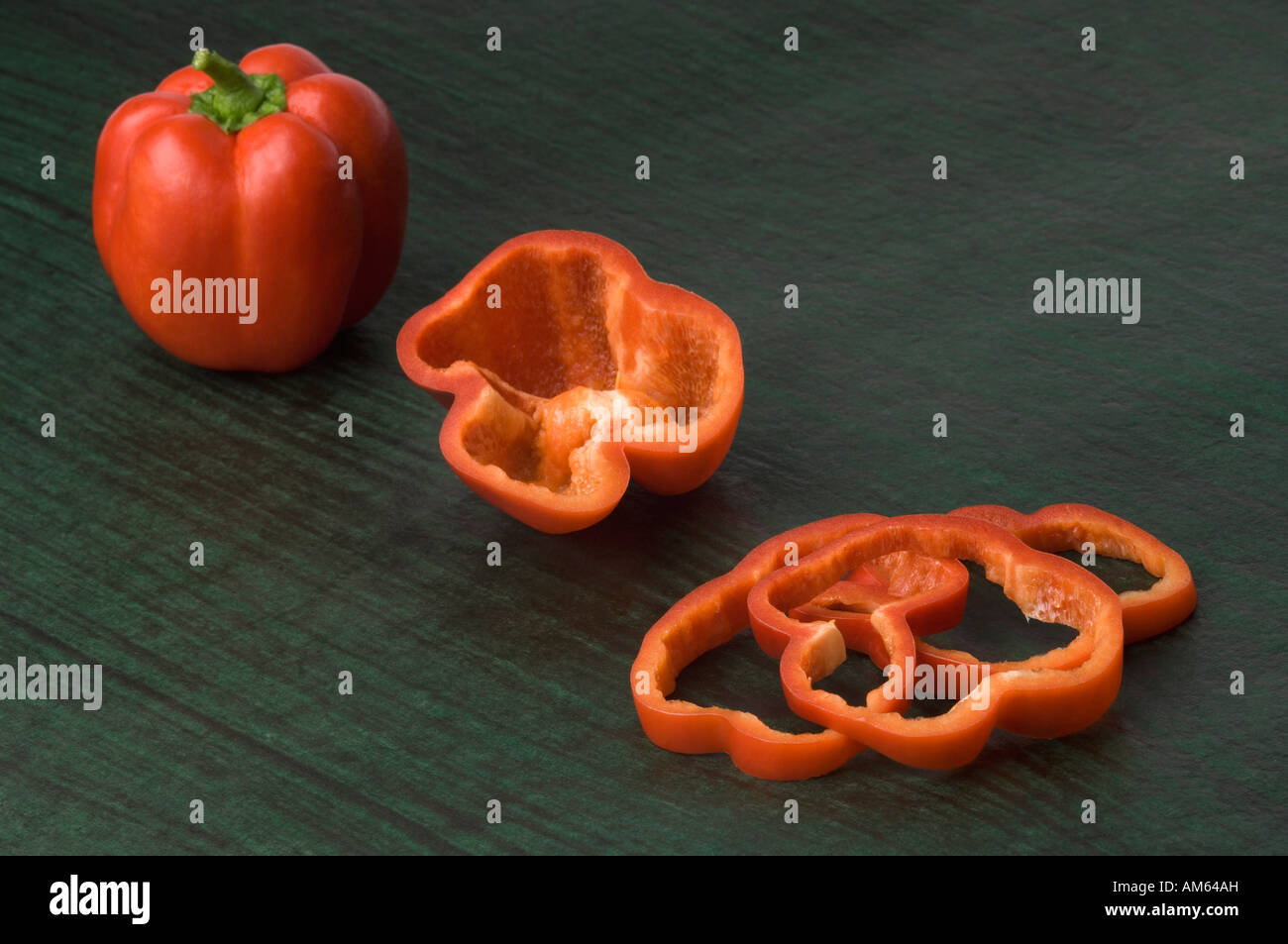 Close-up of a red bell pepper with slices Stock Photo - Alamy