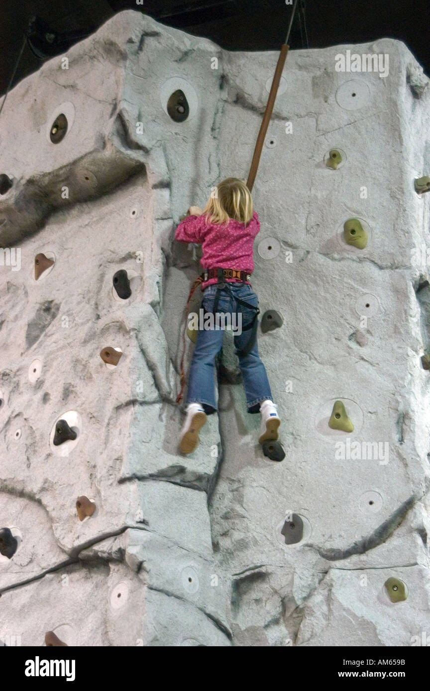 Girl climbing rock wall hi-res stock photography and images - Alamy