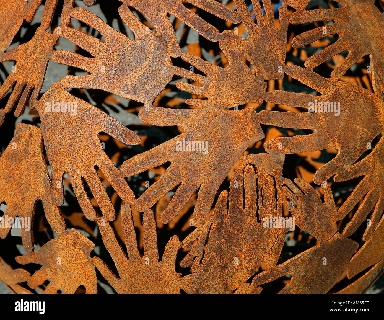 Sculpture, ball made of palms Stock Photo - Alamy