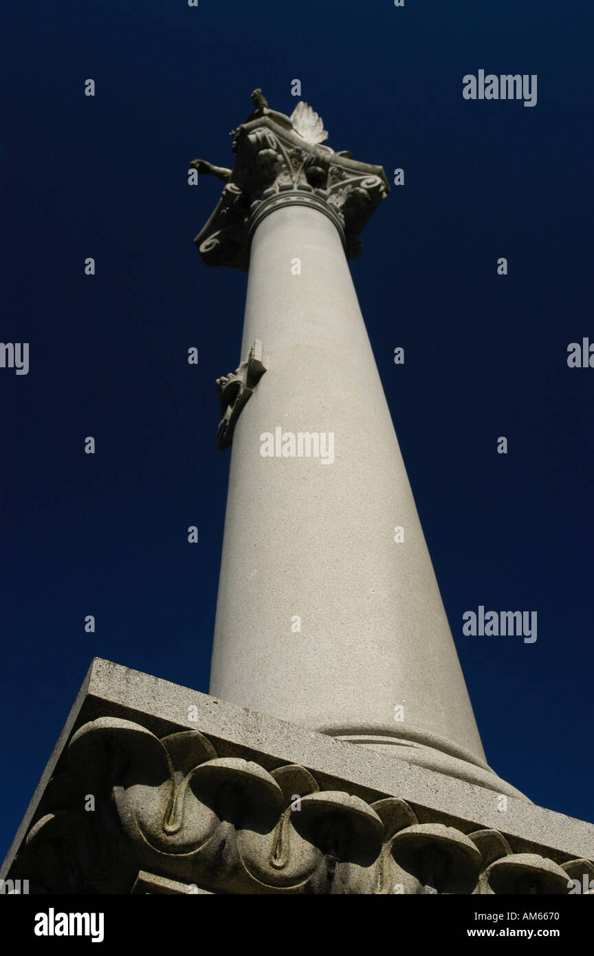 Sculptured stone column monument memorial over burial site in cemetary ...