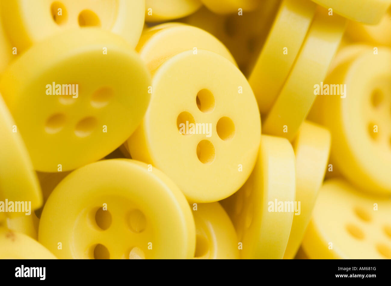 Close-up of yellow buttons Stock Photo - Alamy