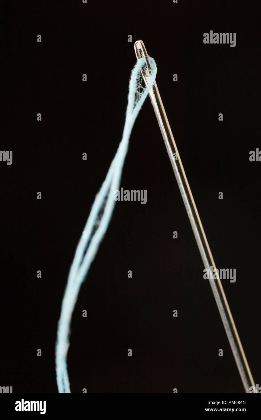 Close-up of a needle and a thread Stock Photo - Alamy