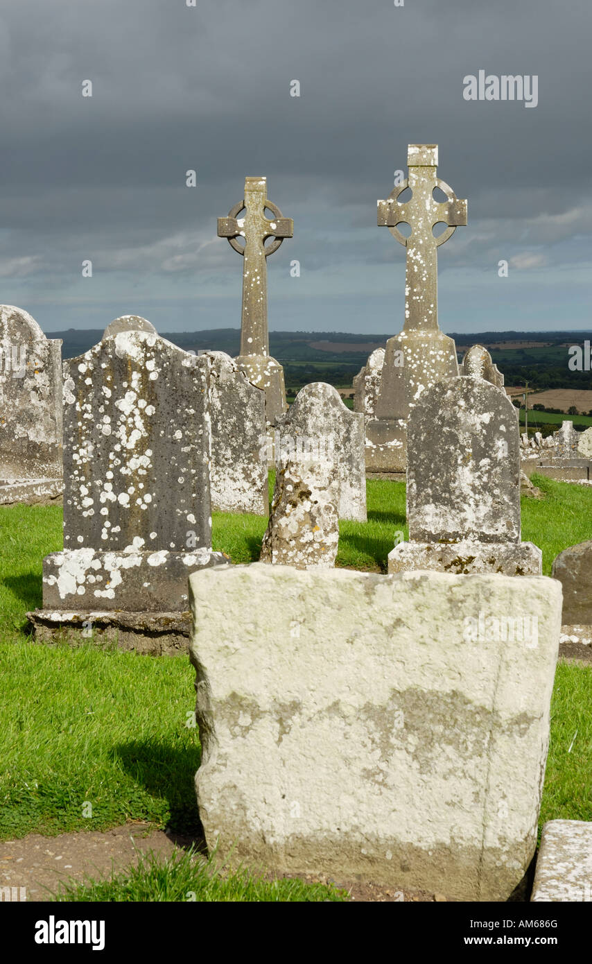 Old weahtered tombstoned at the cemetery of Slane Hill illuminated by ...
