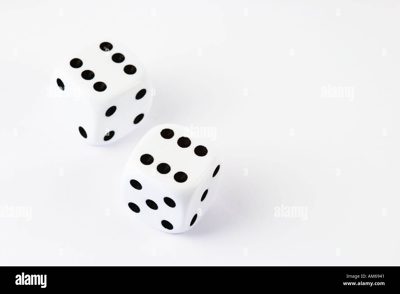 Two board game dice on white background Stock Photo - Alamy