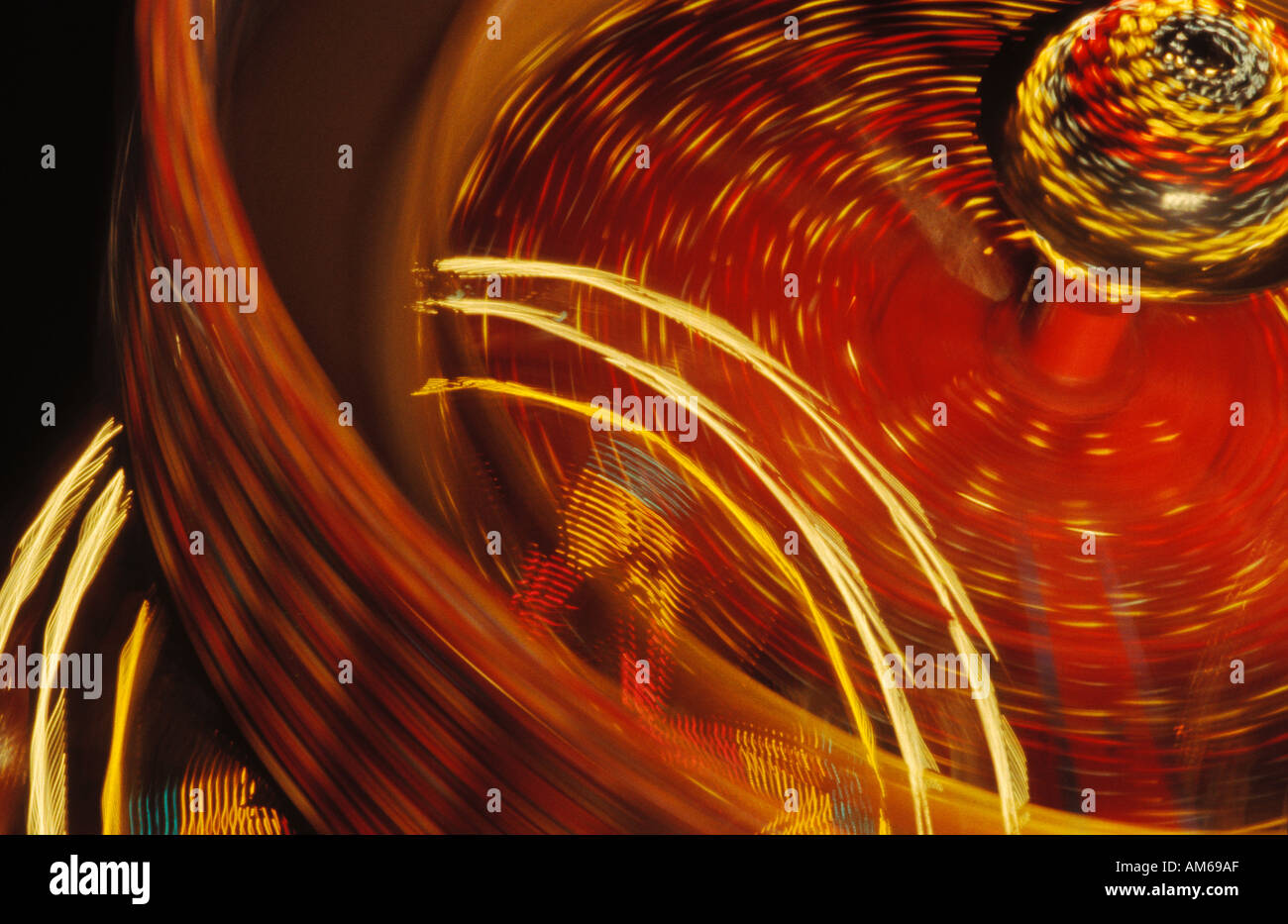 Light trails from a fairground carousel England UK Stock Photo - Alamy