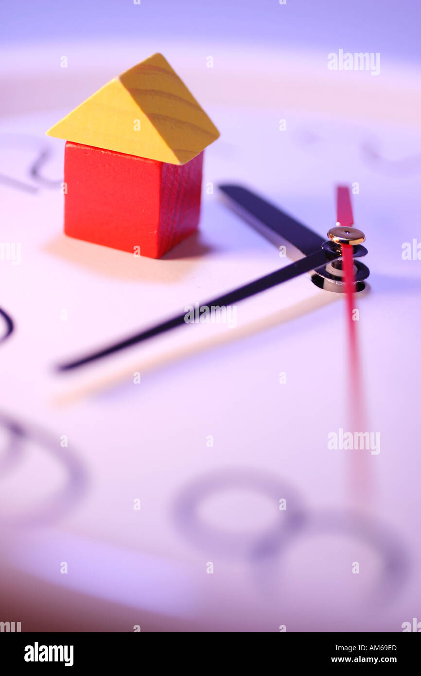 Wooden House Symbol on Clock Stock Photo - Alamy