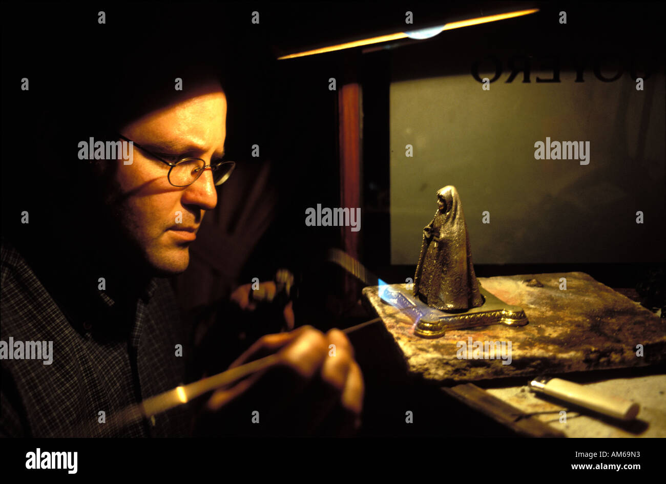Jerez de la Frontera an artist is solding a statue of the Holy Mary in ...