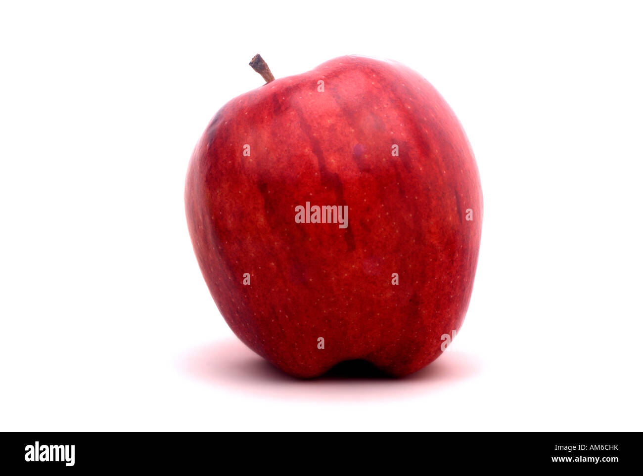 A single red apple against a plain white background Stock Photo - Alamy