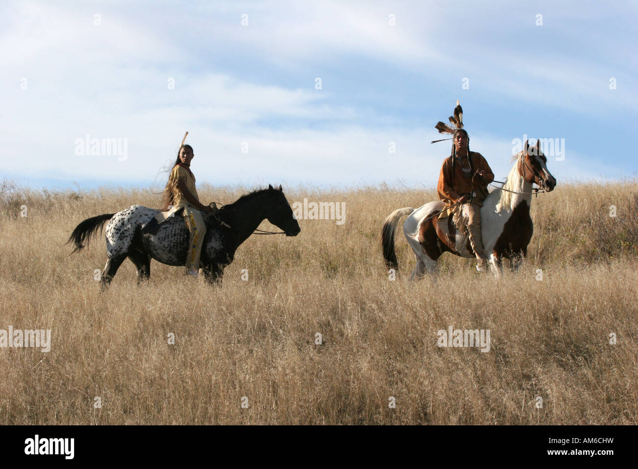 Two Native American Indian men on horseback scouting for enemies or ...