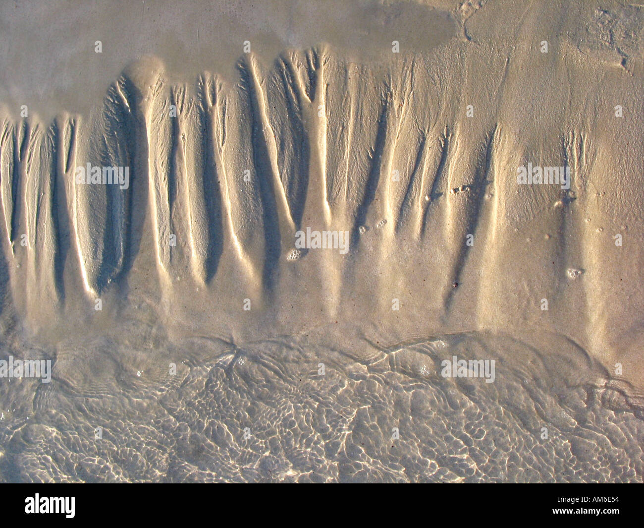 Water marks in beach sand Stock Photo - Alamy