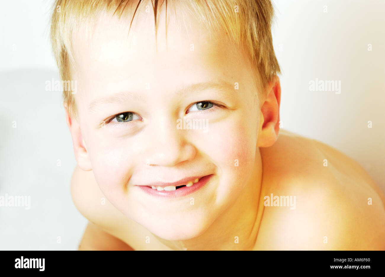 portrait of a kid smiling to camera with missing teeth Stock Photo - Alamy
