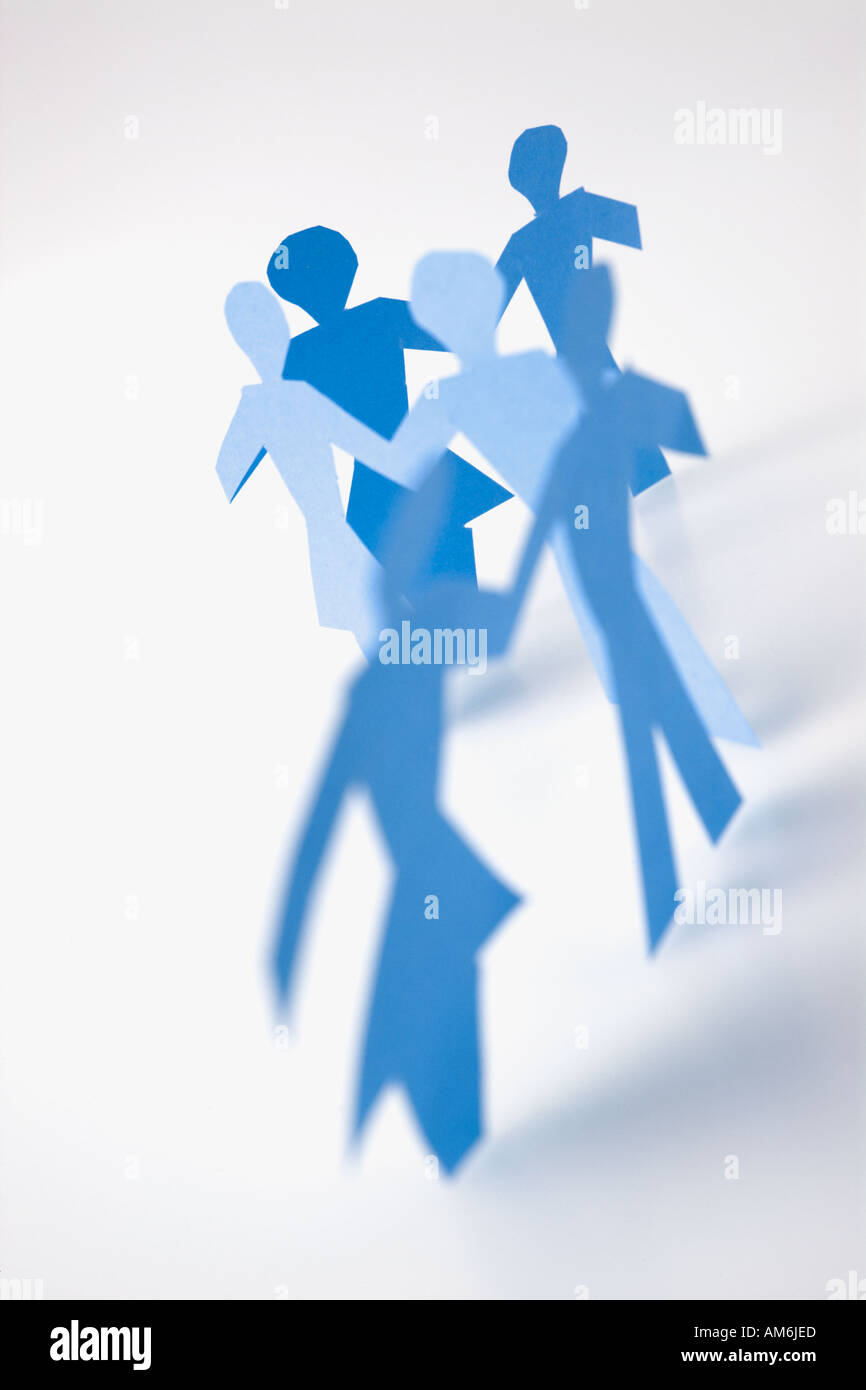 Chain of Paper people Stock Photo - Alamy