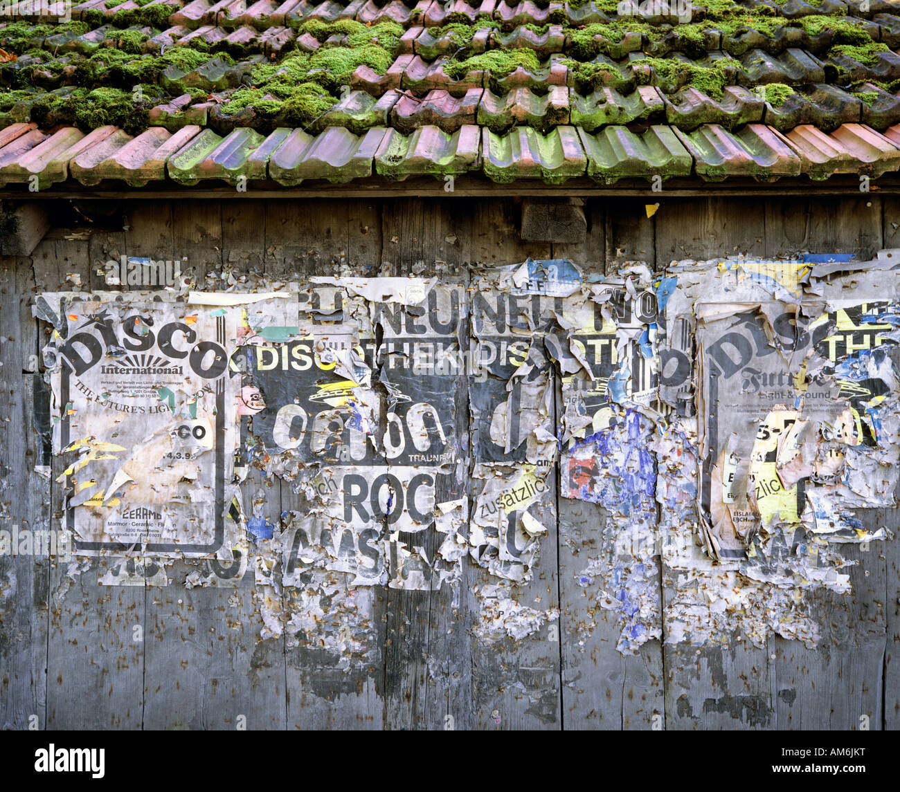 Weathered posters on a barn Stock Photo - Alamy