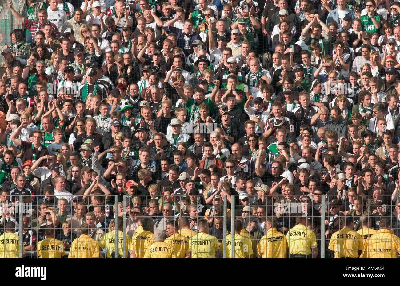 fan corner in a soccer stadium with security in front Stock Photo - Alamy