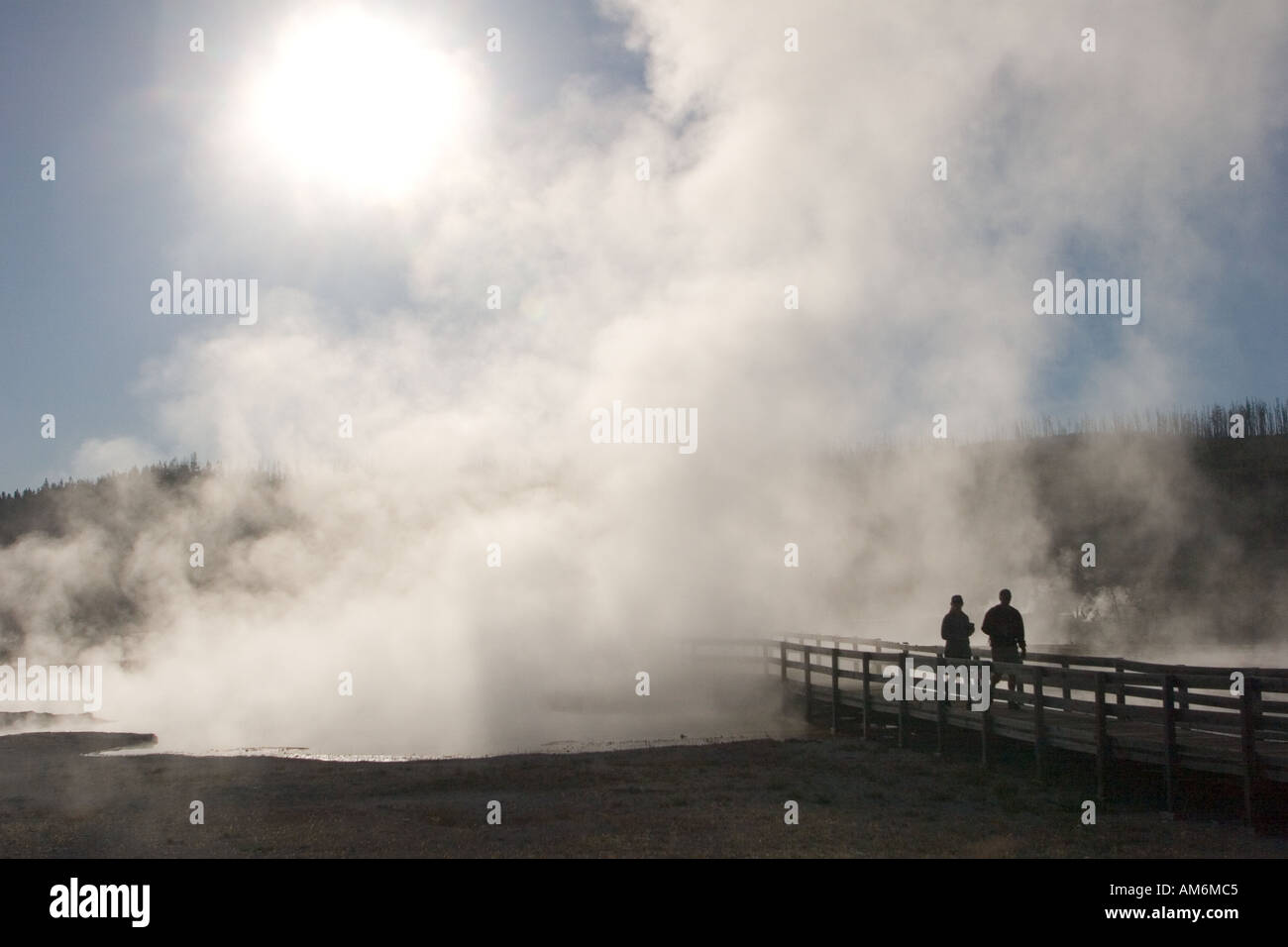 A misty morning at Geyser Basin in Yellowstone National Park ...