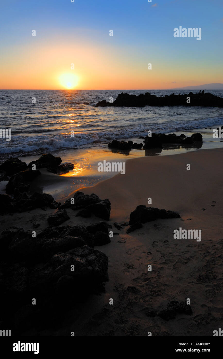 Beatiful sunset at the rock and sand beach in Wailea Maui Hawaii USA ...
