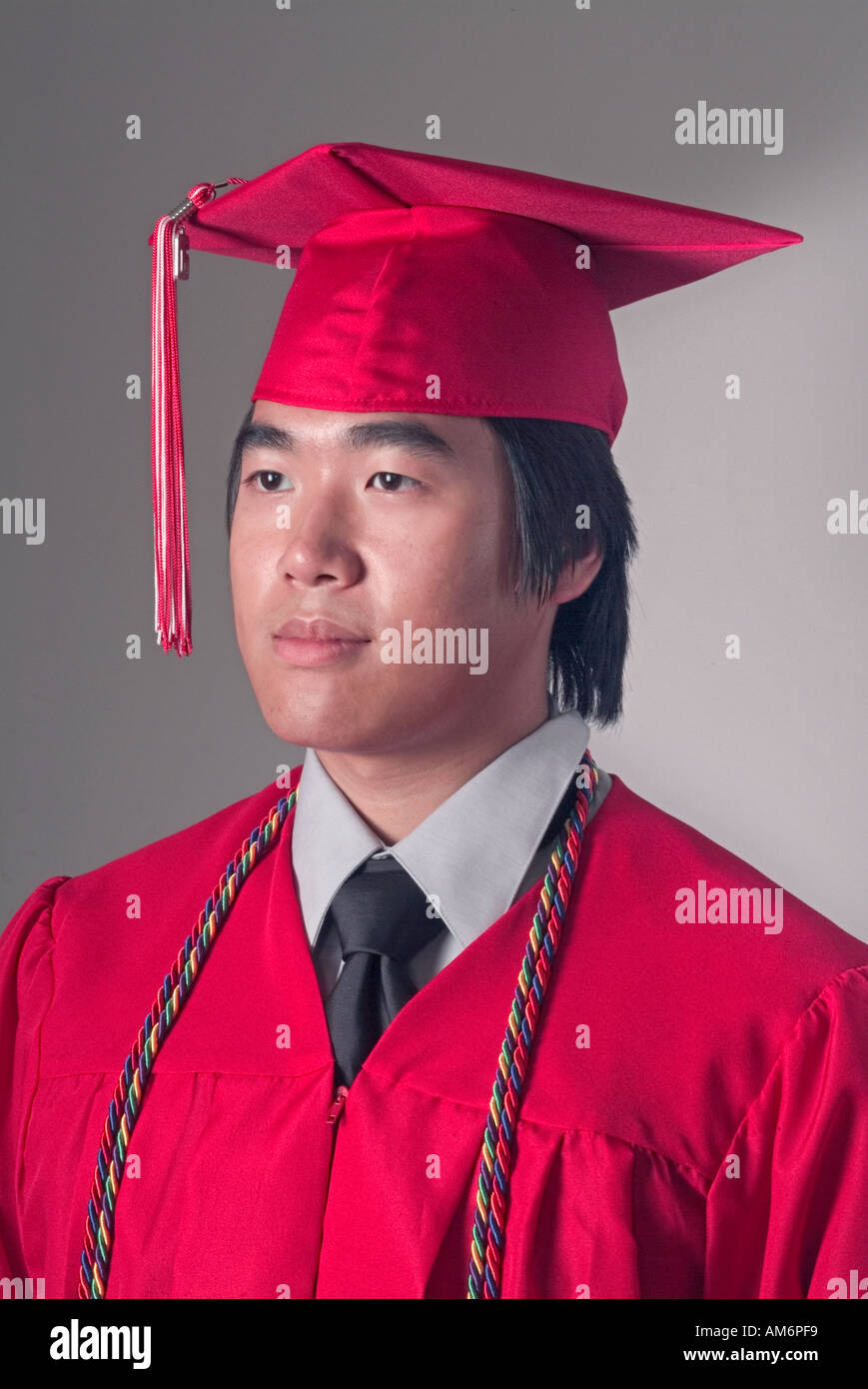 Portrait of handsome Chinese male in cap and gown Stock Photo - Alamy