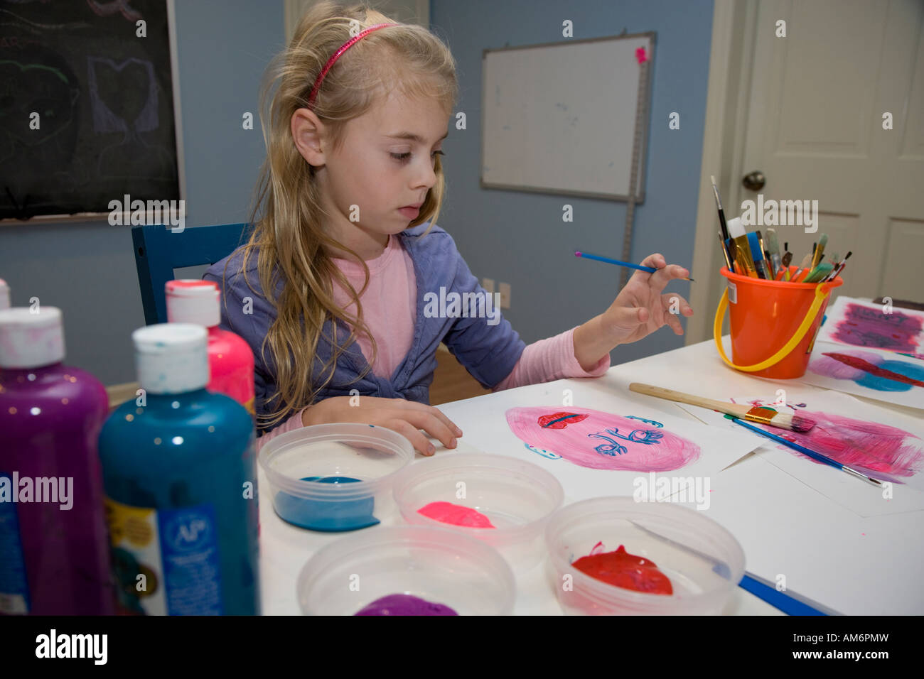 Child painting a portrait Stock Photo - Alamy