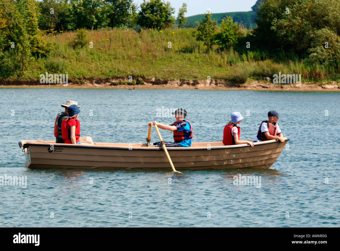 A Family In A Rowing Boat On Carsington Water In Derbyshire England ...