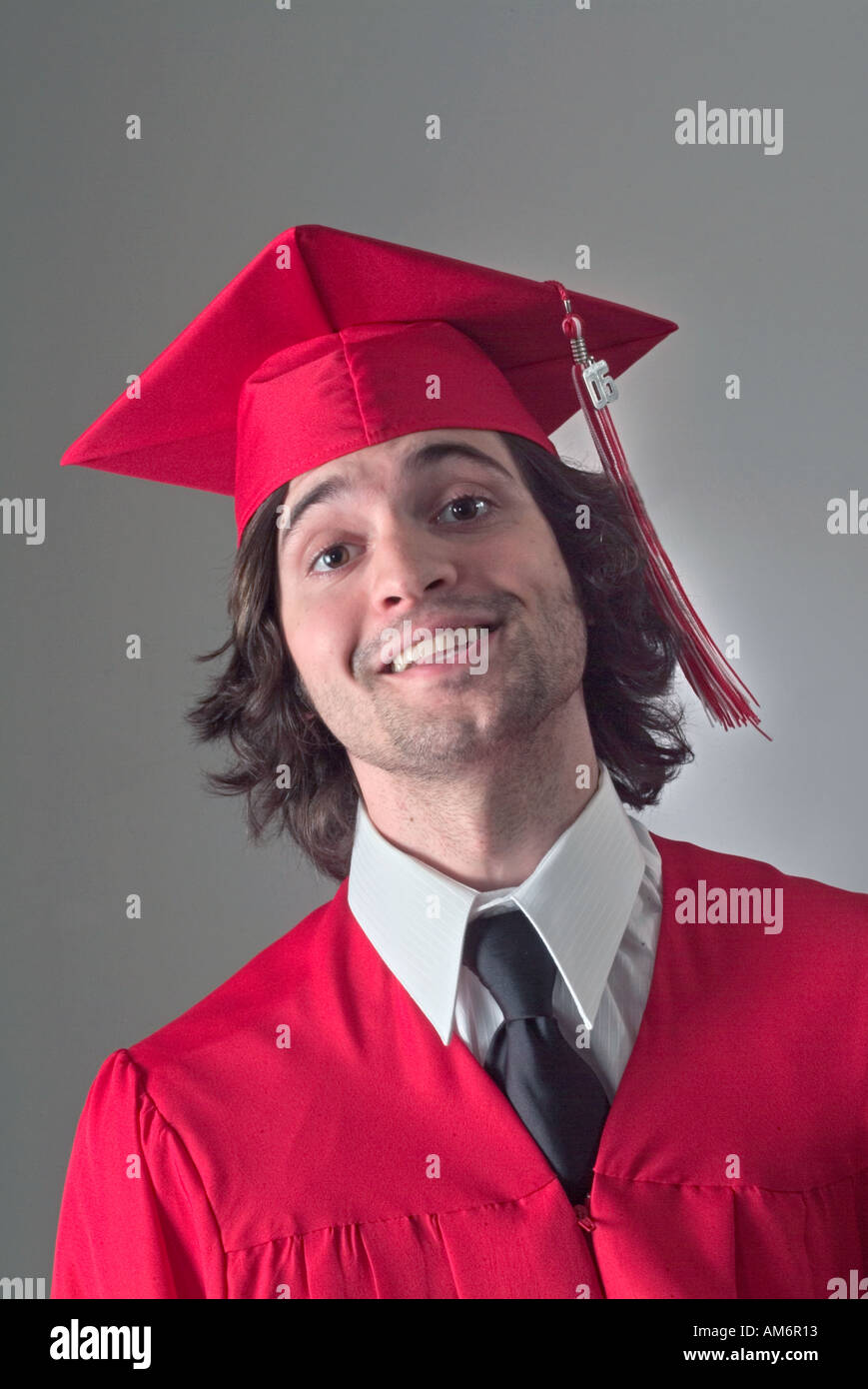 Boy in red graduation gown hi-res stock photography and images - Alamy