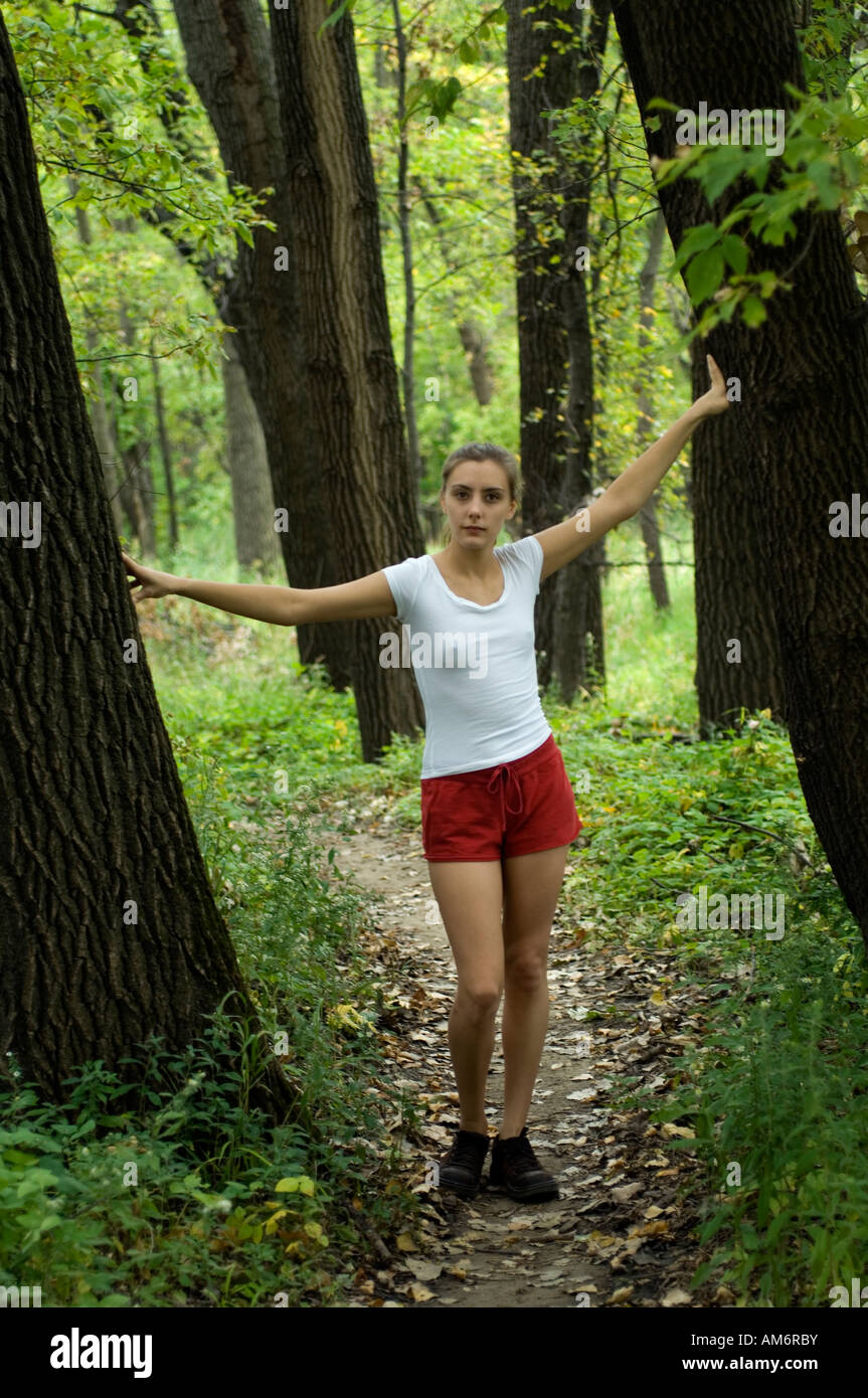 A woman standing in the forest Stock Photo - Alamy
