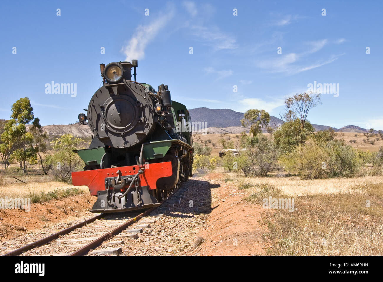 an old steam train goes through the australian outback Stock Photo - Alamy