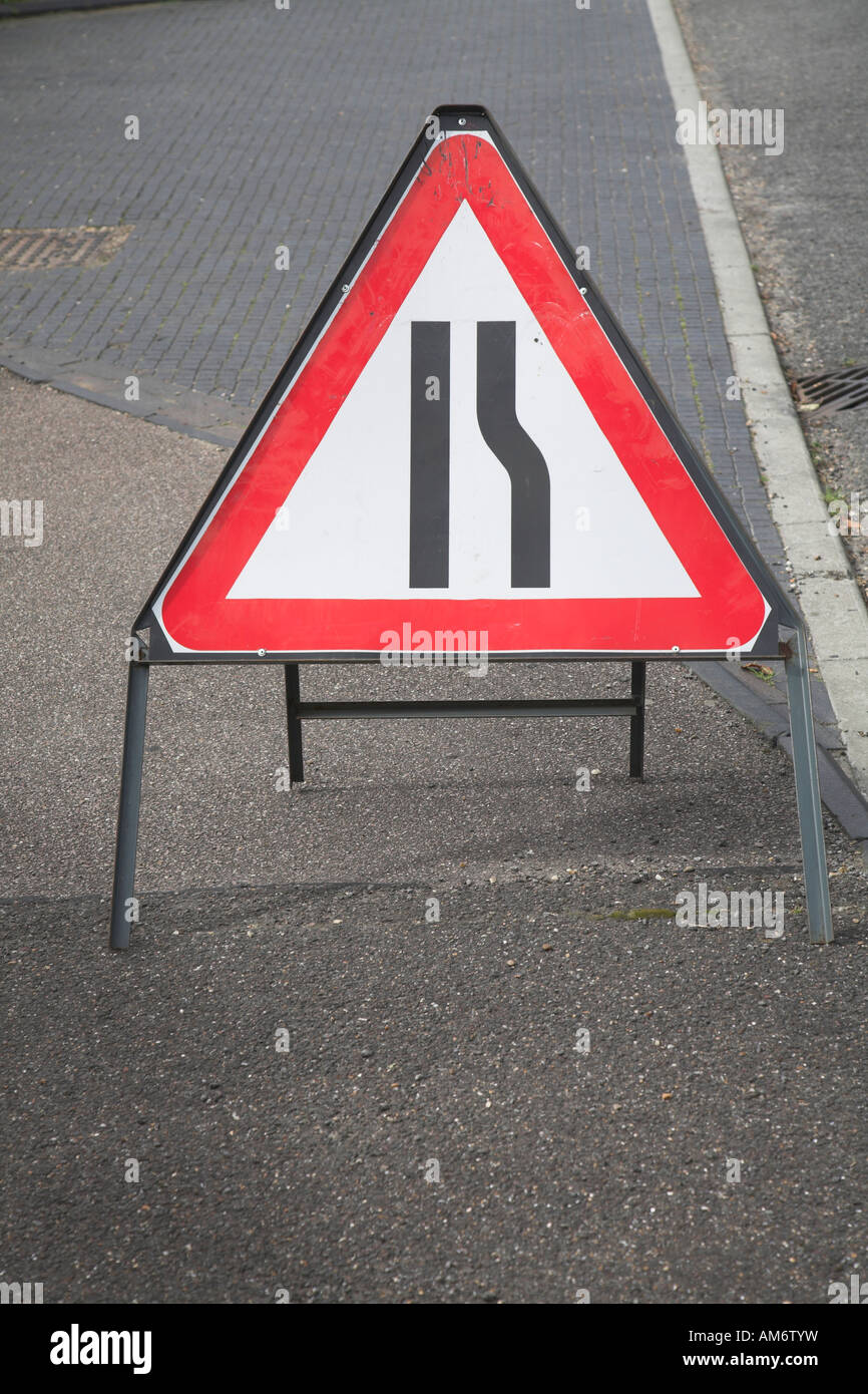 Triangular sign road narrows on metal standing frame Uk Stock Photo - Alamy