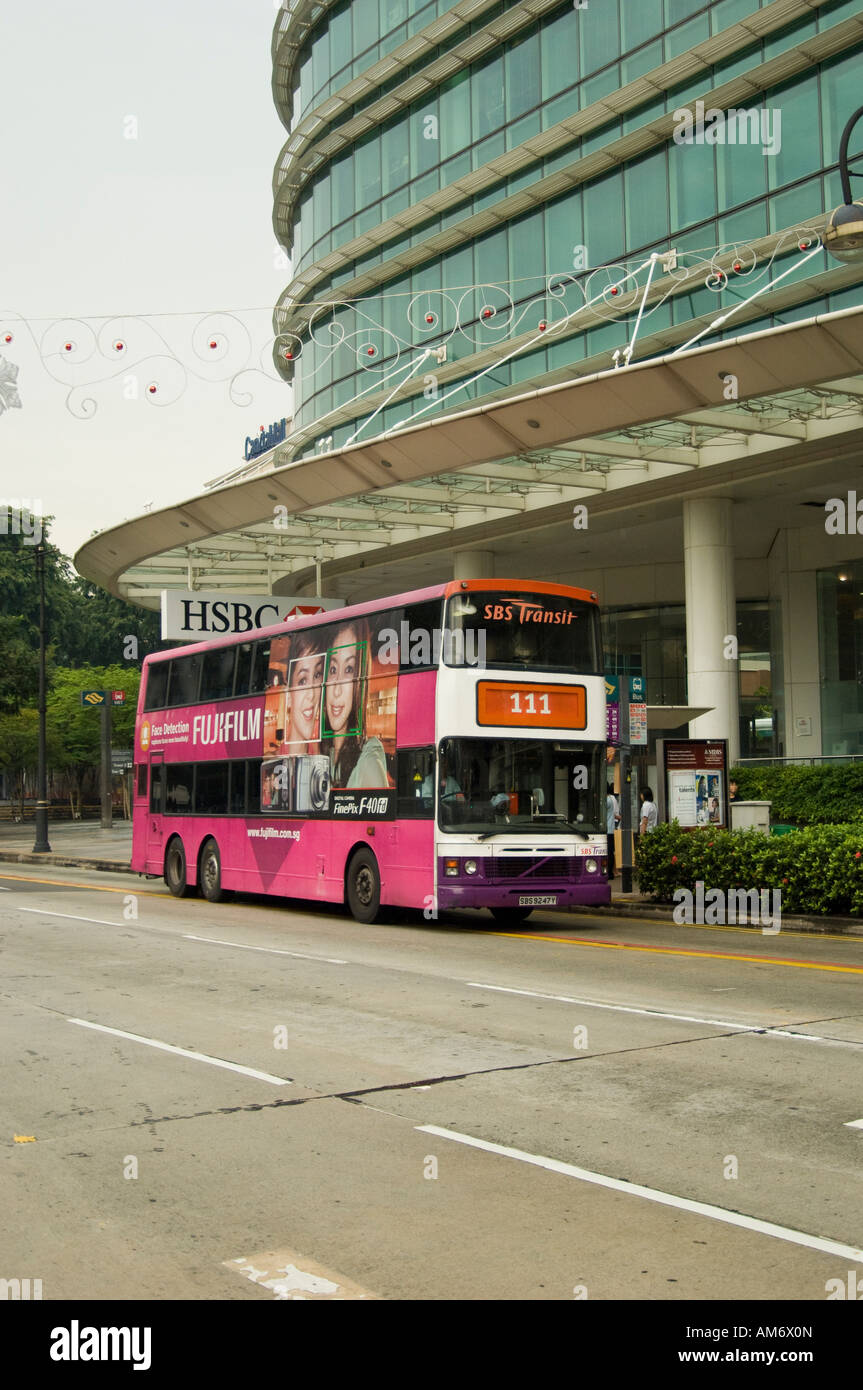 Double decker bus outside multi story building station in singapore ...