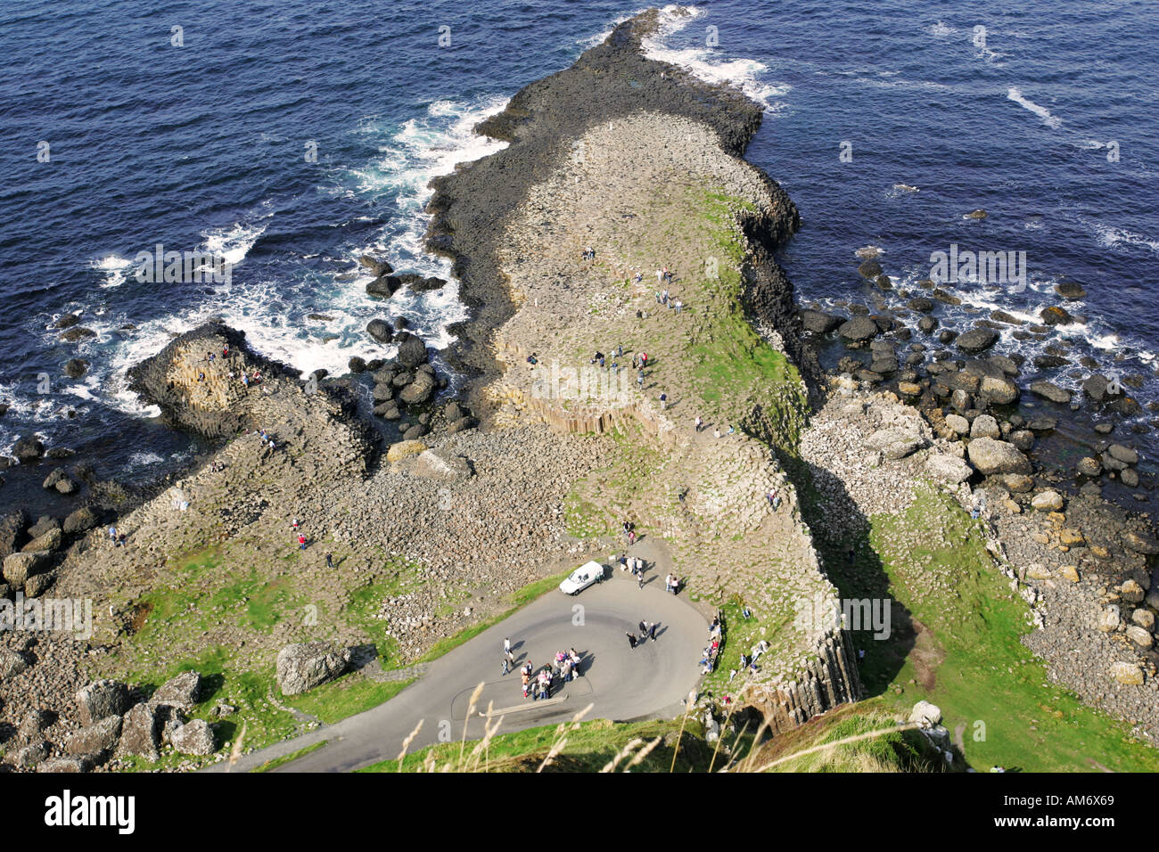 Aerial view of the famous Giants Causeway coast and tourist bus park ...