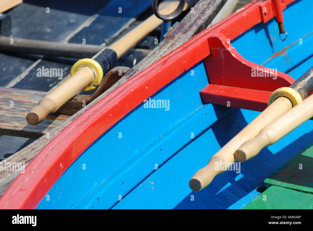 oars in vibrant coloured rowing boats Stock Photo - Alamy