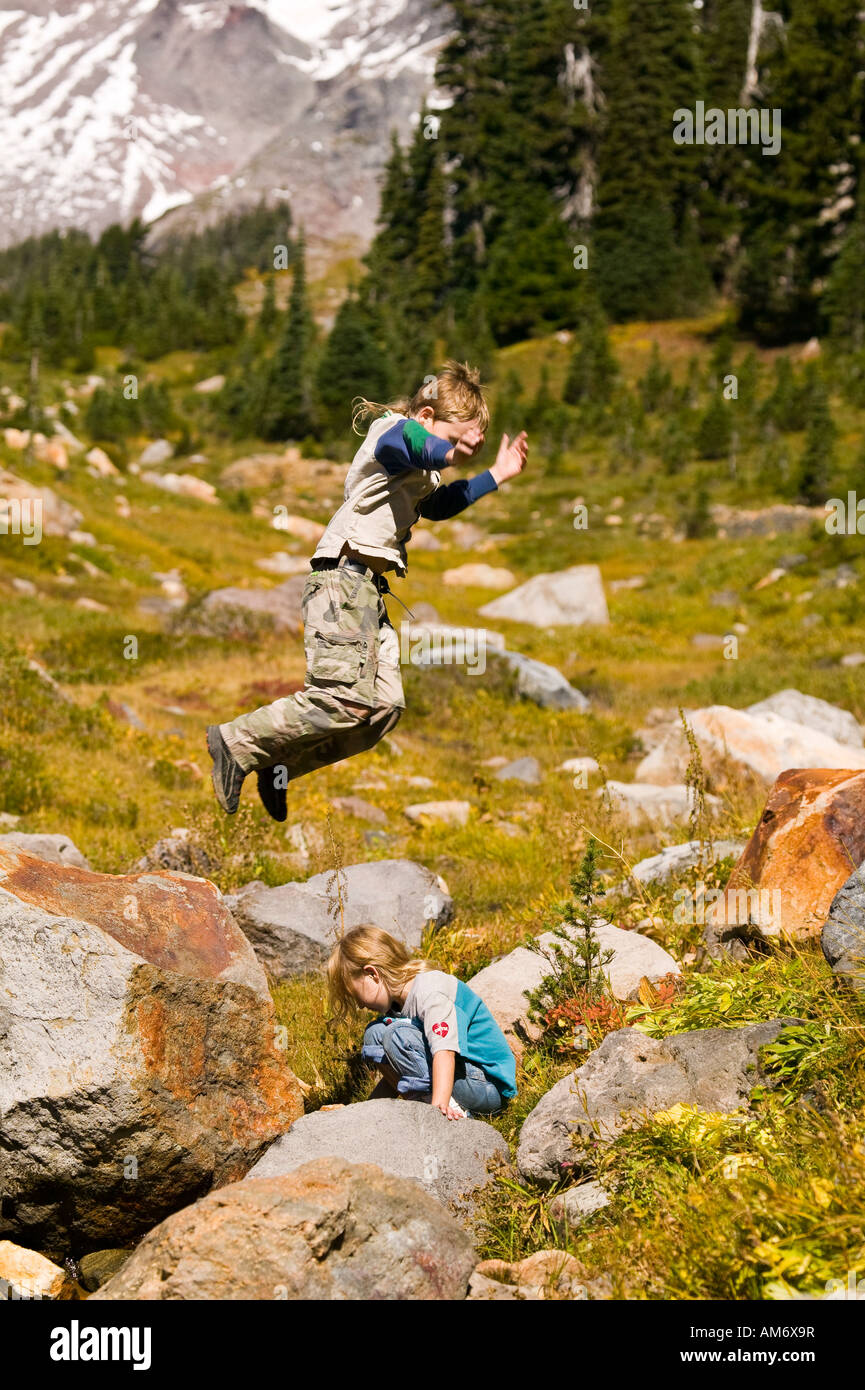 Children jumping off a rock hi-res stock photography and images - Alamy