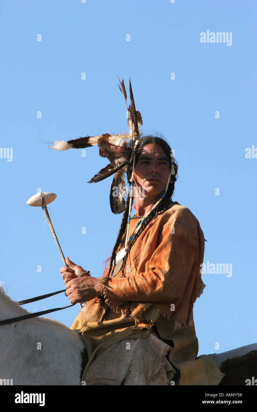 A Native American Indian man siting bareback on a horse riding the ...