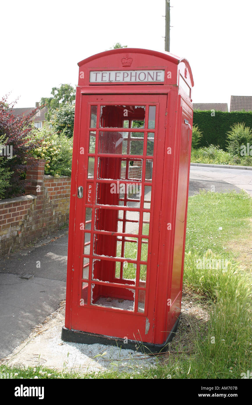 A smashed and vandalised red telephone box on a council estate in ...