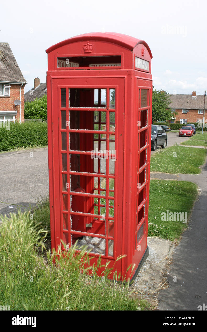 A smashed and vandalised red telephone box on a council estate in ...