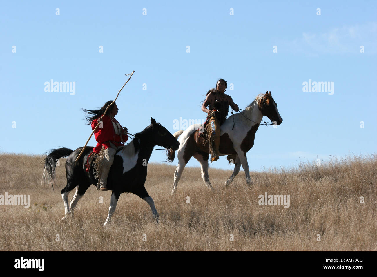 Two Native American Indians riding horseback looking for ememies ...