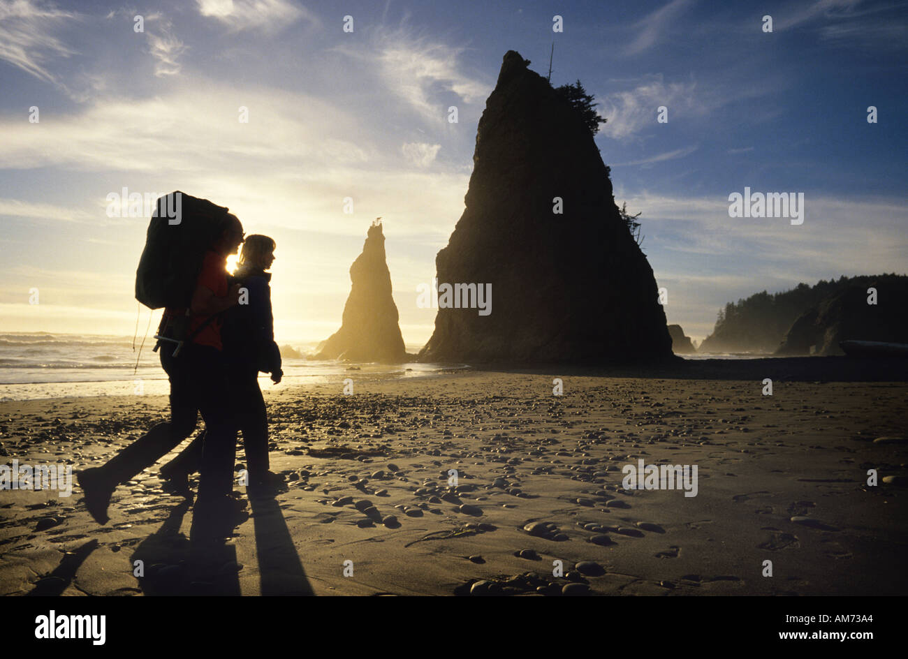 Hikers at Hole in the Wall Beach Olympic National Park Washington State ...