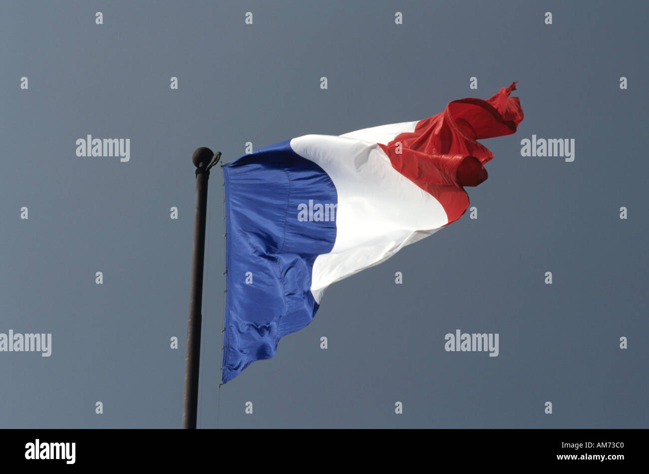 French flag blowing in the wind Stock Photo - Alamy