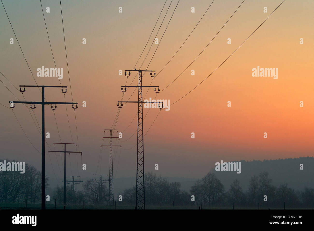 Pylons and power lines in morning light hi-res stock photography and ...