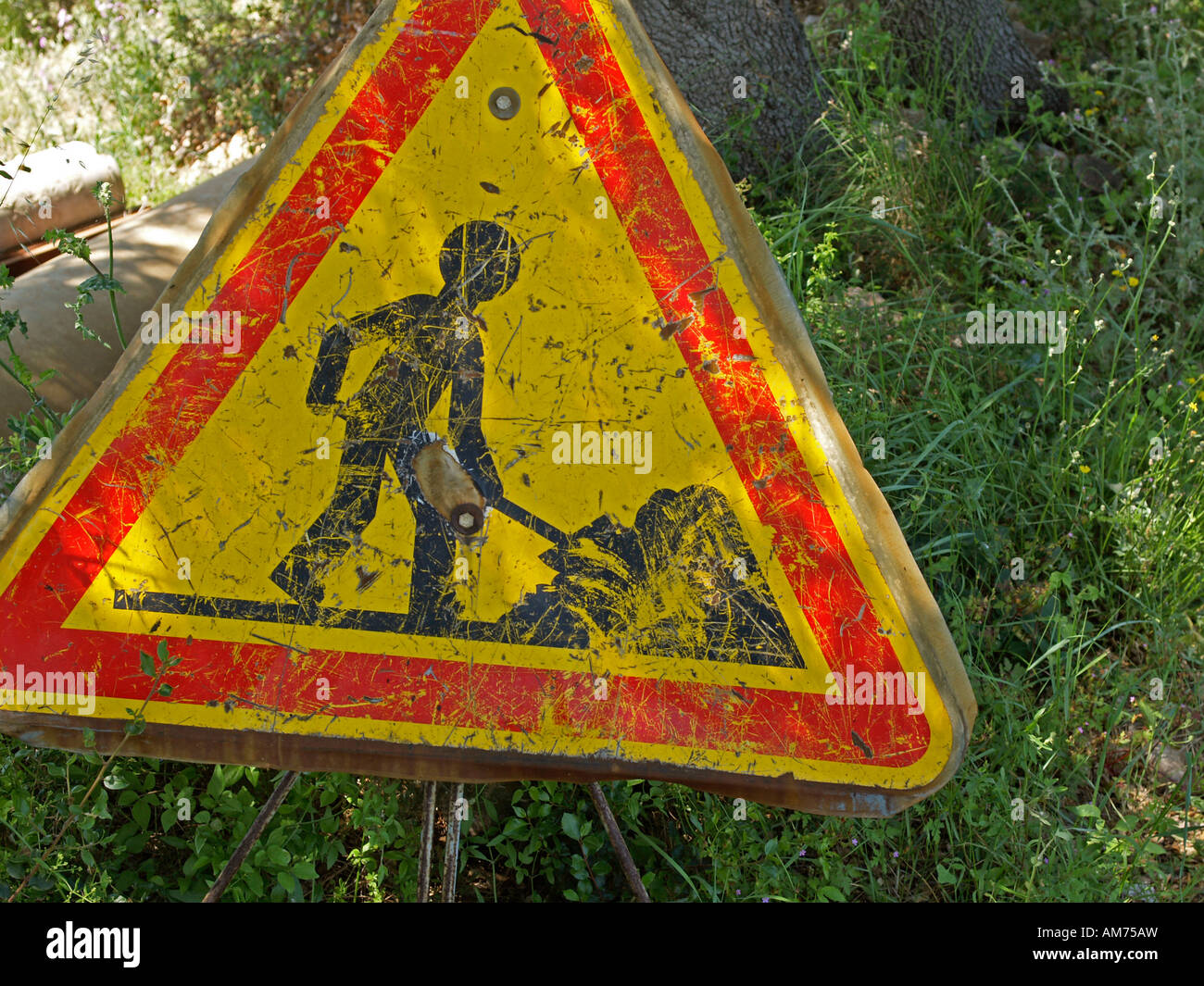dirty old sign for building site at a road Stock Photo - Alamy