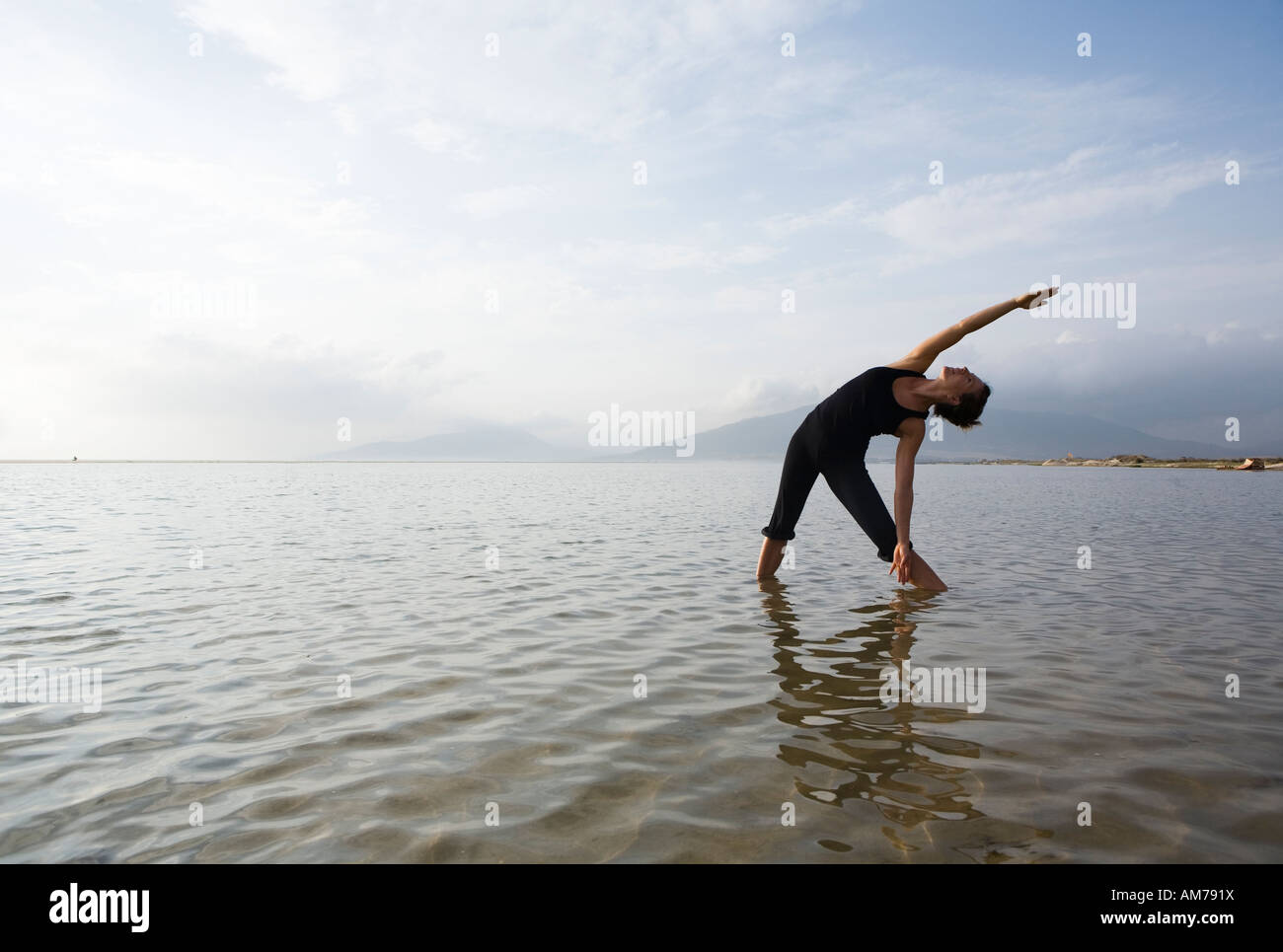 woman doing yoga posture in nature Stock Photo - Alamy