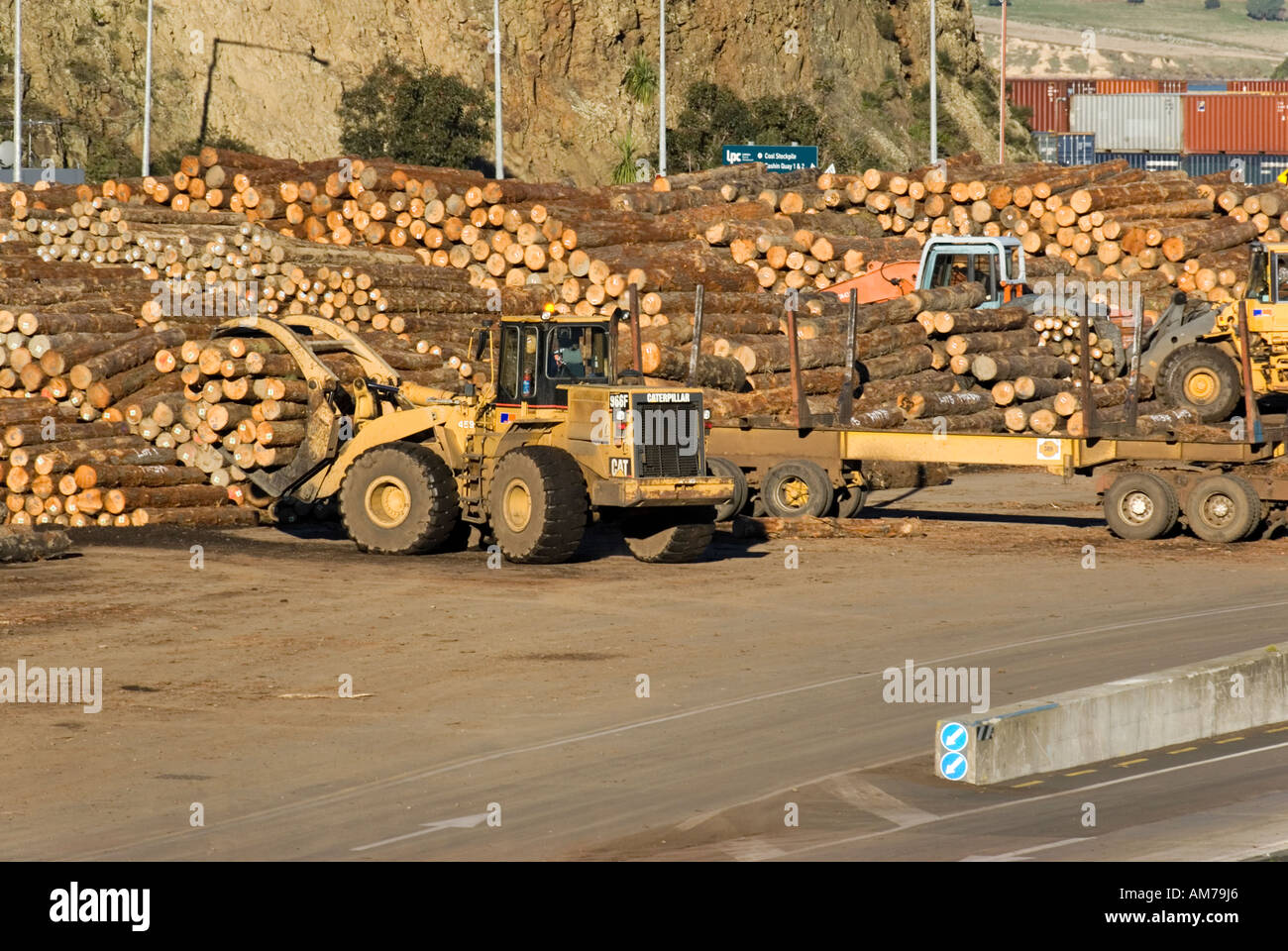Timber being loaded at a port Stock Photo - Alamy