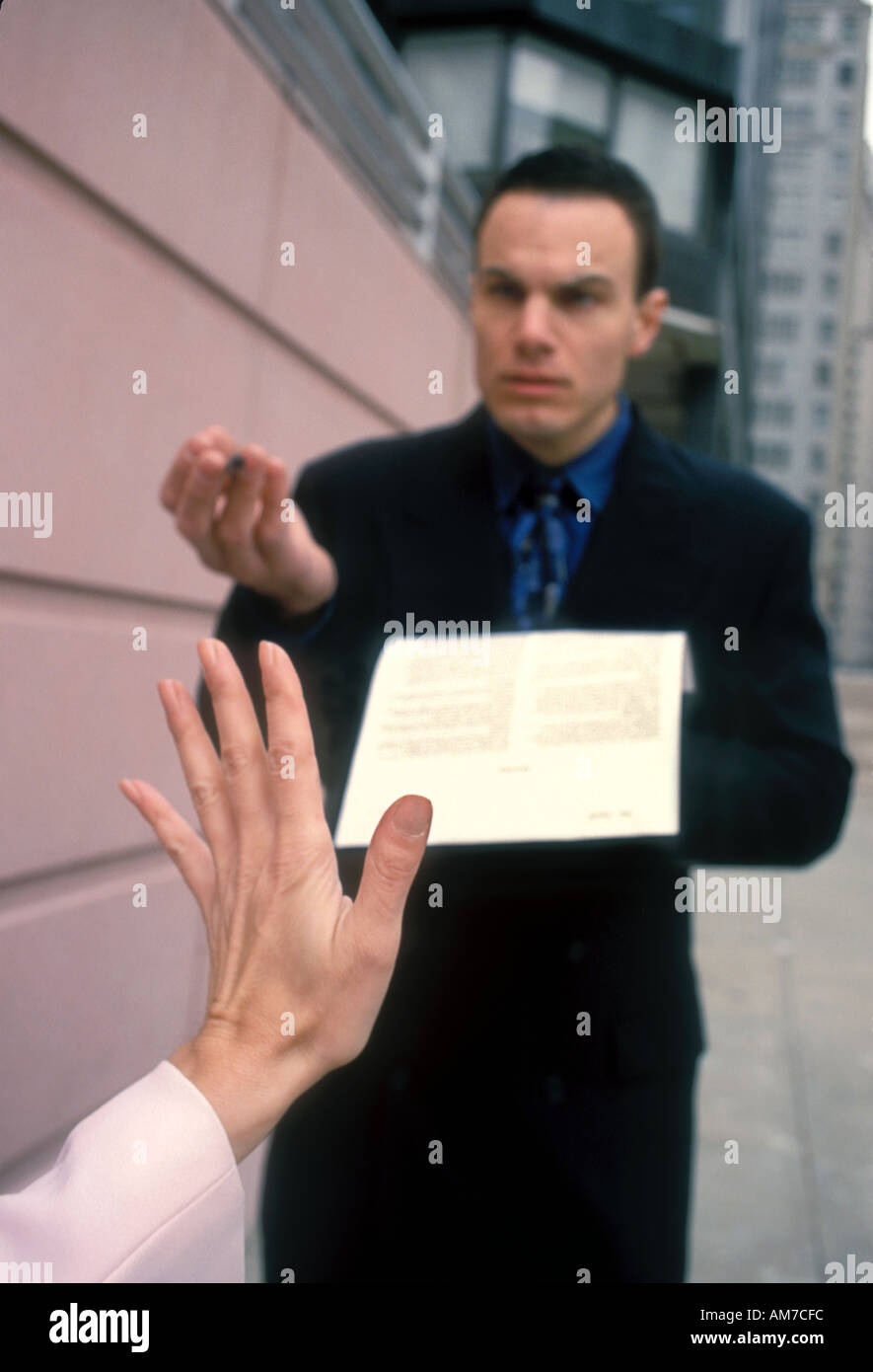 Refusing to sign a contract Stock Photo - Alamy