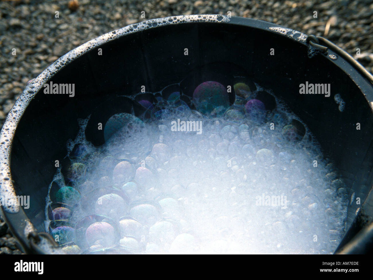Bubbles in a Black Bucket Stock Photo - Alamy