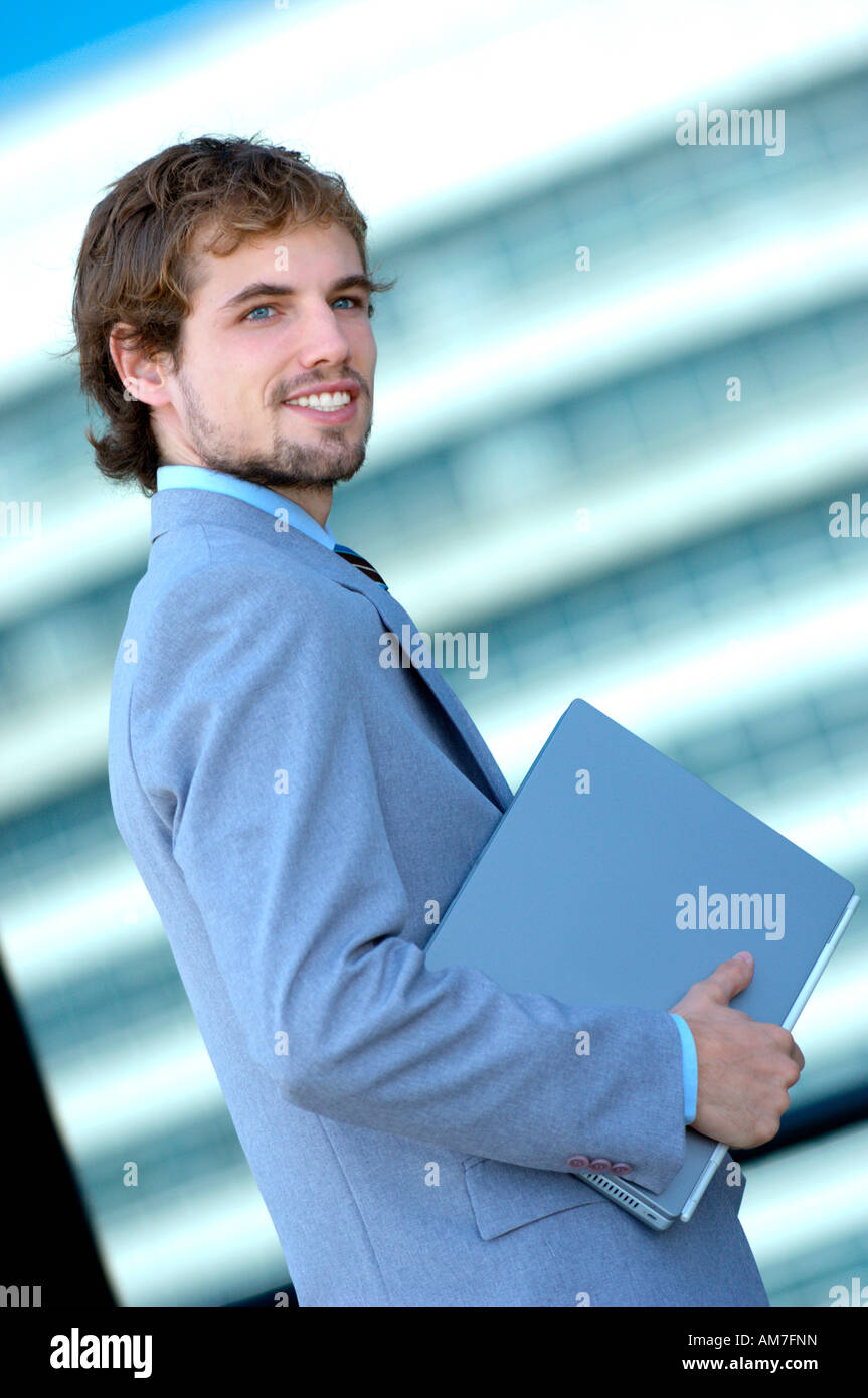 Young man holding file, side view Stock Photo - Alamy