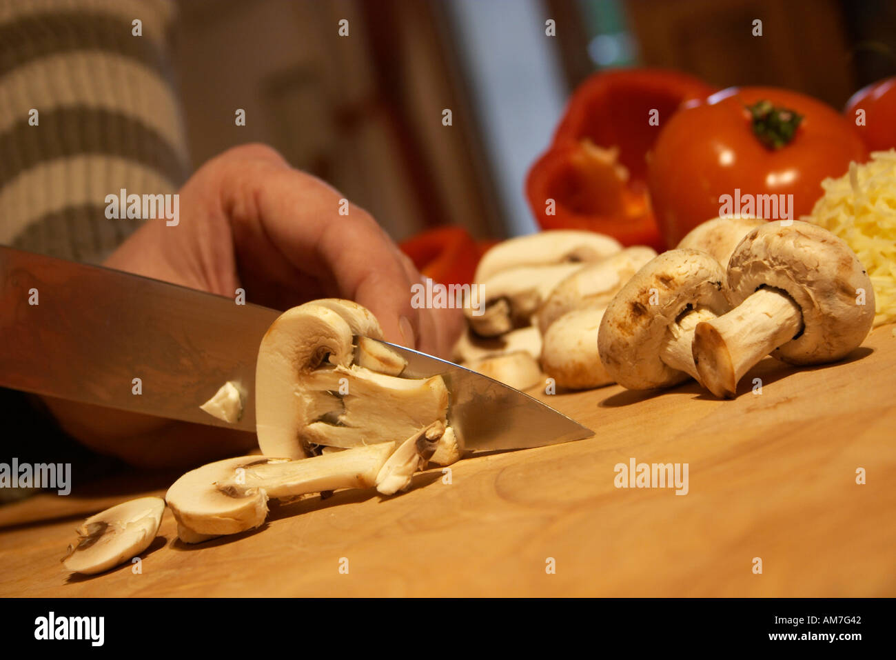 Person cutting vegetables in a house environment Stock Photo - Alamy