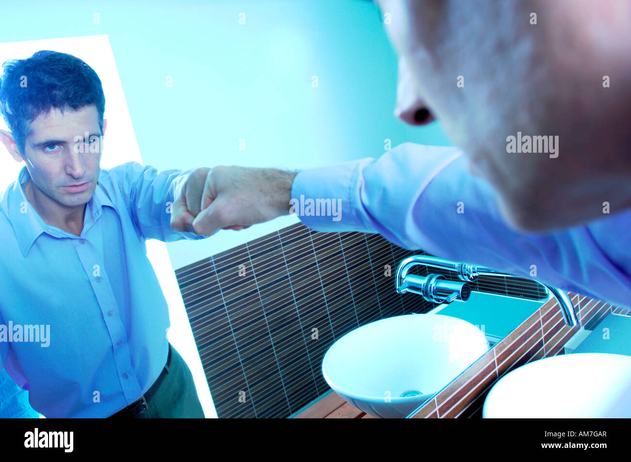 Mature adult businessman looking in mirror, close-up Stock Photo - Alamy